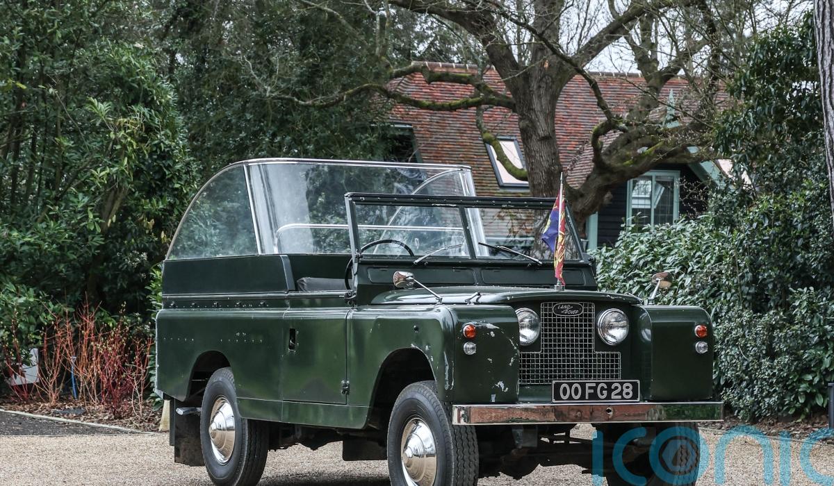 Ceremonial Land Rover used by the late Queen Elizabeth going under the ...