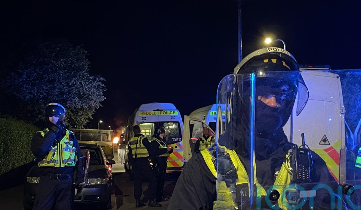 Missiles thrown at police, cars set alight during riot in Cardiff ...