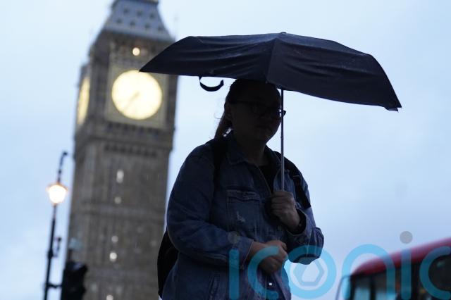 In pictures: ‘Atrocious’ weather as band of rain travels across the UK ...