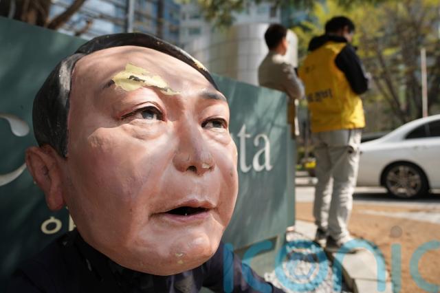Ousted South Korean leader greets supporters as he leaves presidential ...